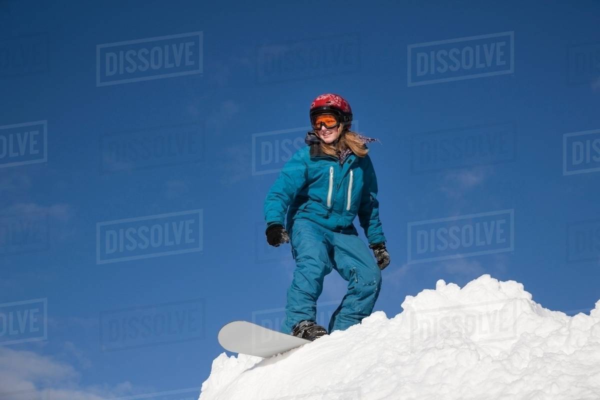 Girl snowboarding - Royalty-free Stock Photo | Dissolve