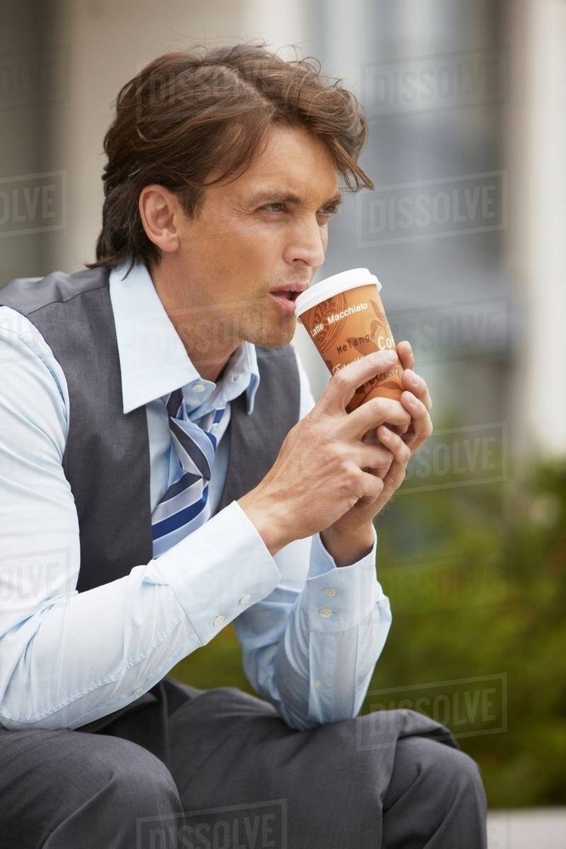 Business man taking a coffee break - Stock Photo - Dissolve