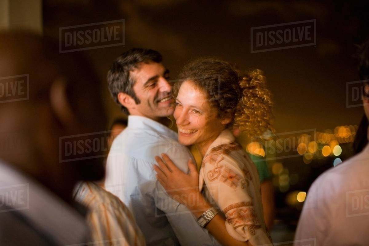 Couple dancing at party at night - Royalty-free Stock Photo | Dissolve