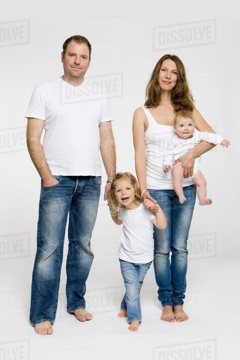 Family standing together - Stock Photo - Dissolve