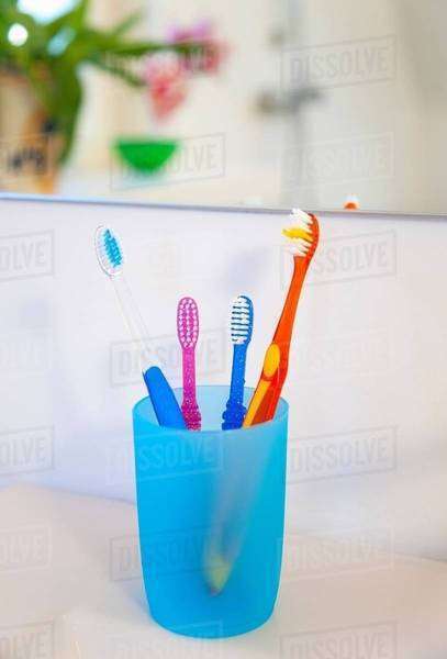 Toothbrushes in cup - Royalty-free Stock Photo | Dissolve