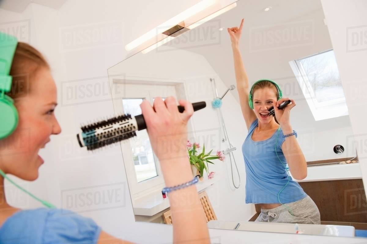 Girl singing in bathroom - Royalty-free Stock Photo | Dissolve