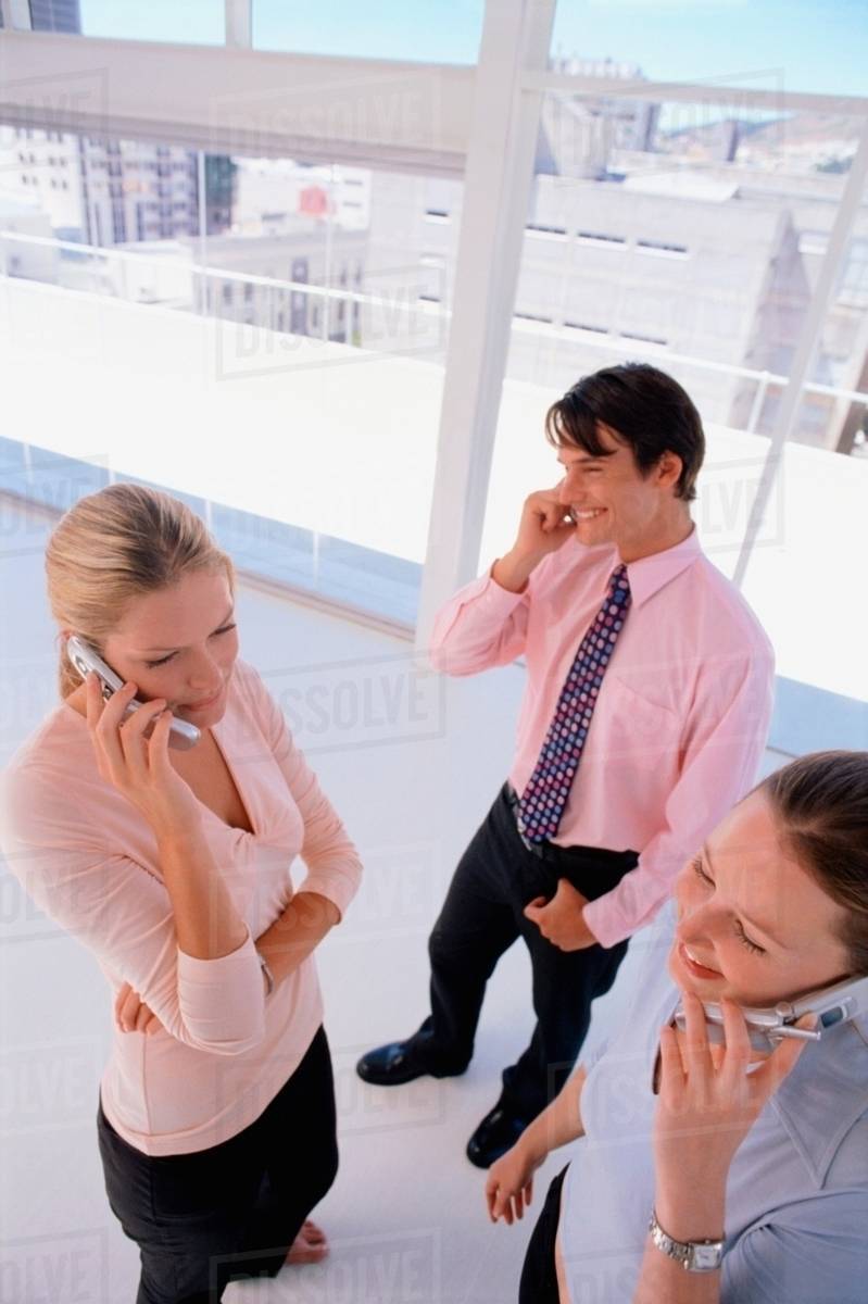 Business people talking on cell phones - Royalty-free Stock Photo ...