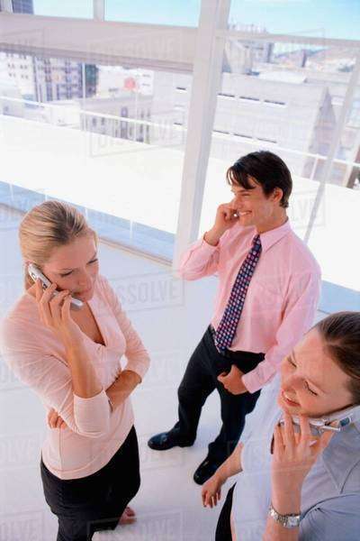 Business people talking on cell phones - Royalty-free Stock Photo ...