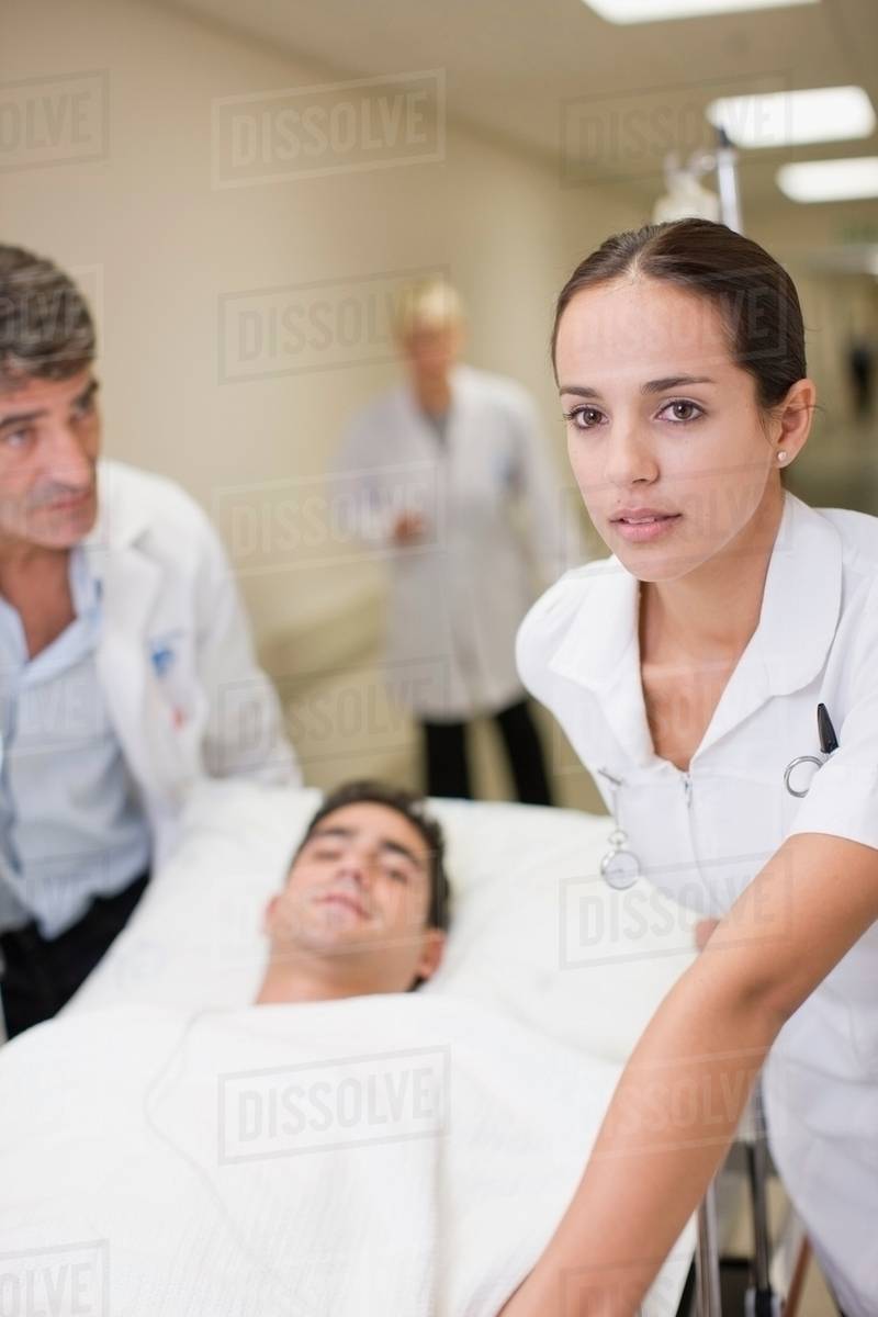 Nurse rushing patient down hallway - Royalty-free Stock Photo | Dissolve