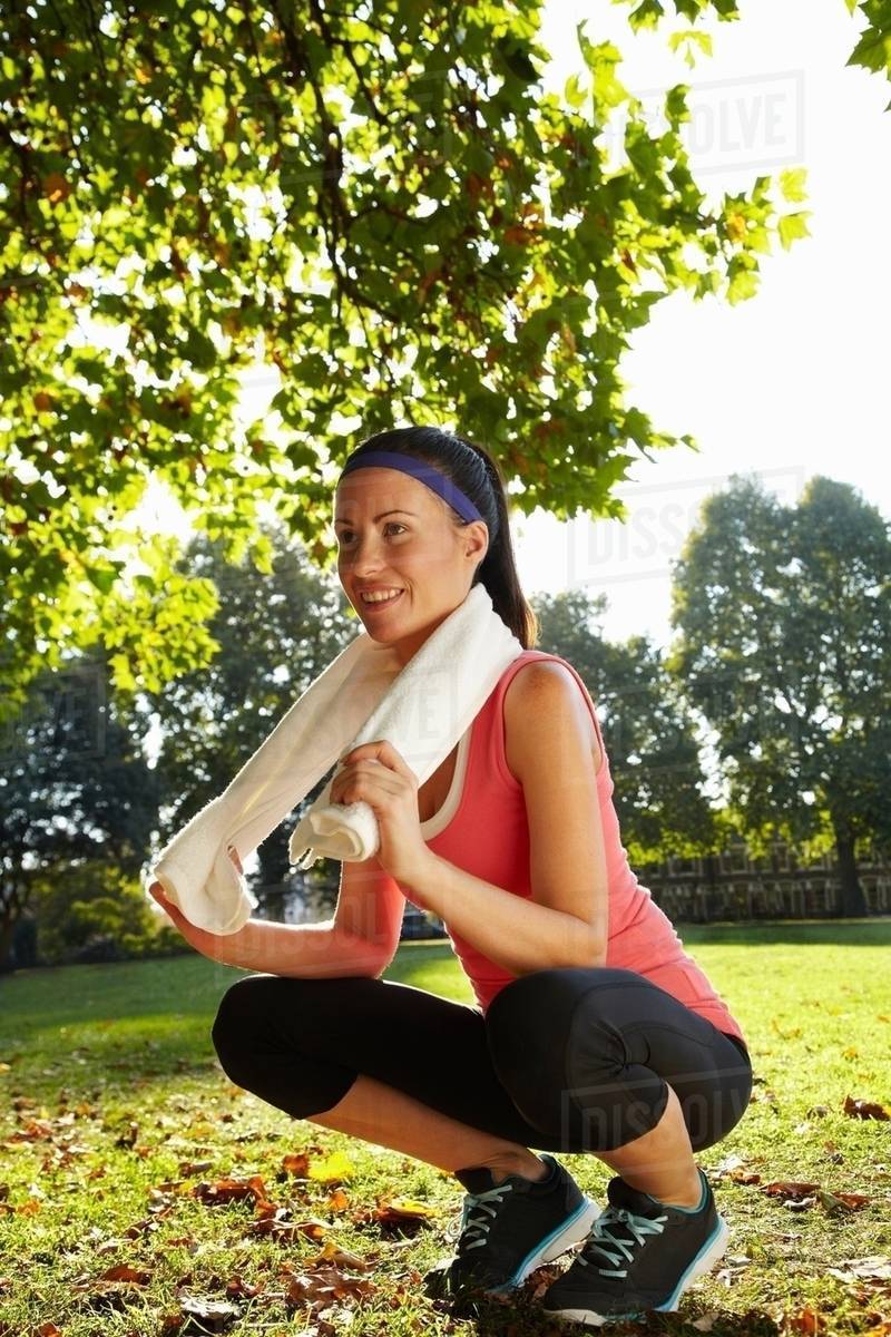 Runner wearing towel in park - Royalty-free Stock Photo | Dissolve