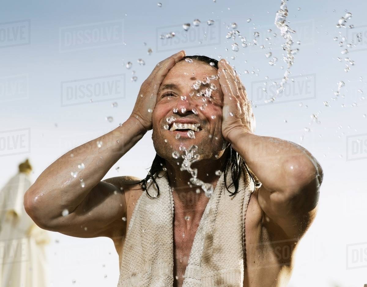 Man splashing his face with water - Royalty-free Stock Photo | Dissolve