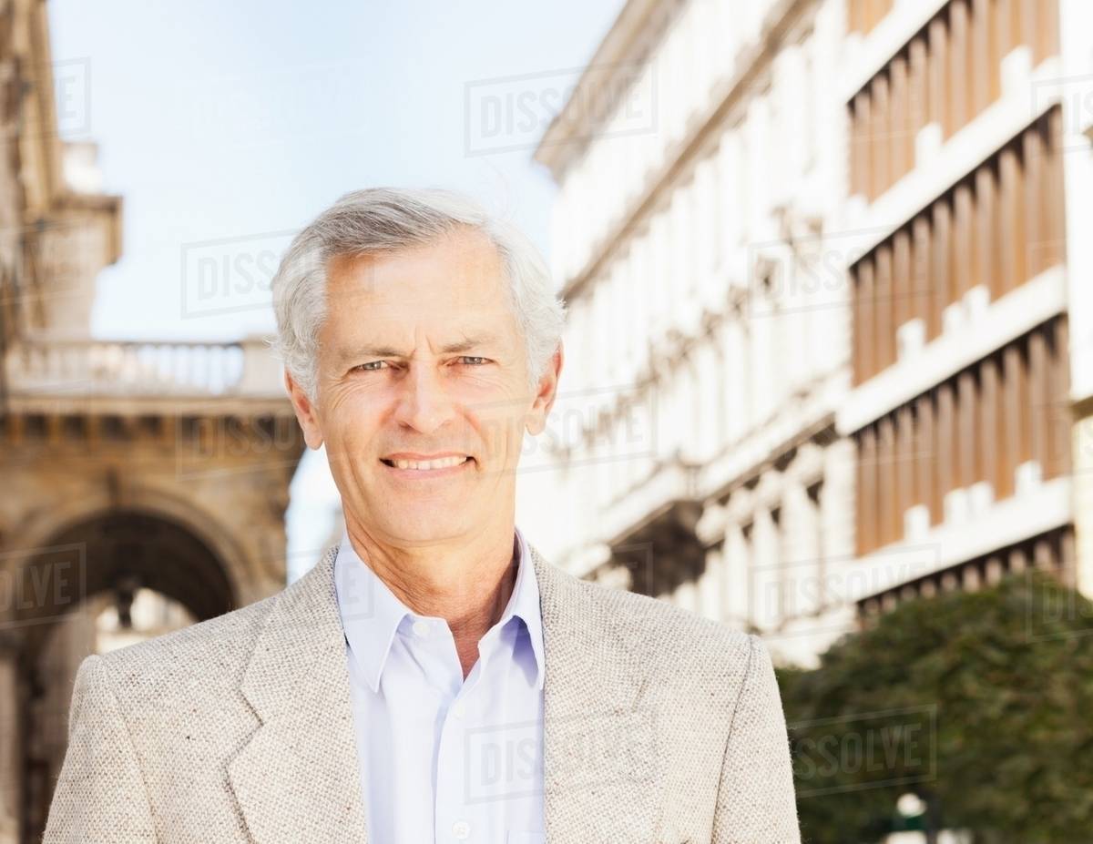 Close up of businessman's smiling face - Stock Photo - Dissolve