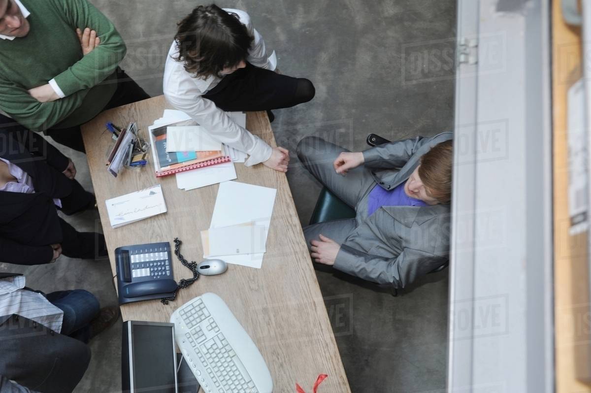 Overhead view of business people at desk - Royalty-free Stock Photo ...