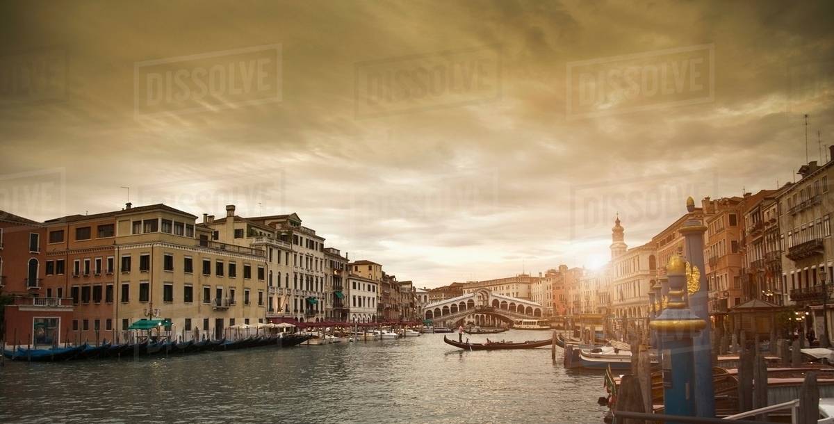 Buildings and boats on urban canal - Royalty-free Stock Photo | Dissolve