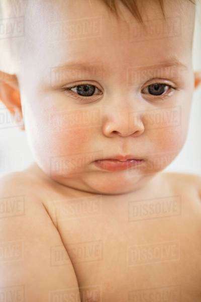 Close up of baby girls face - Stock Photo - Dissolve
