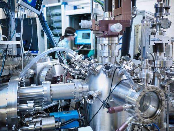 Materials science chamber with a scientist looking at beamline (HHG ...