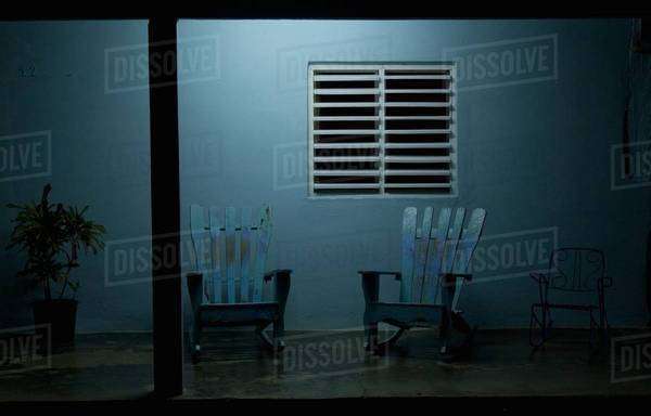 Empty rocking chairs on porch at night - Royalty-free Stock Photo ...