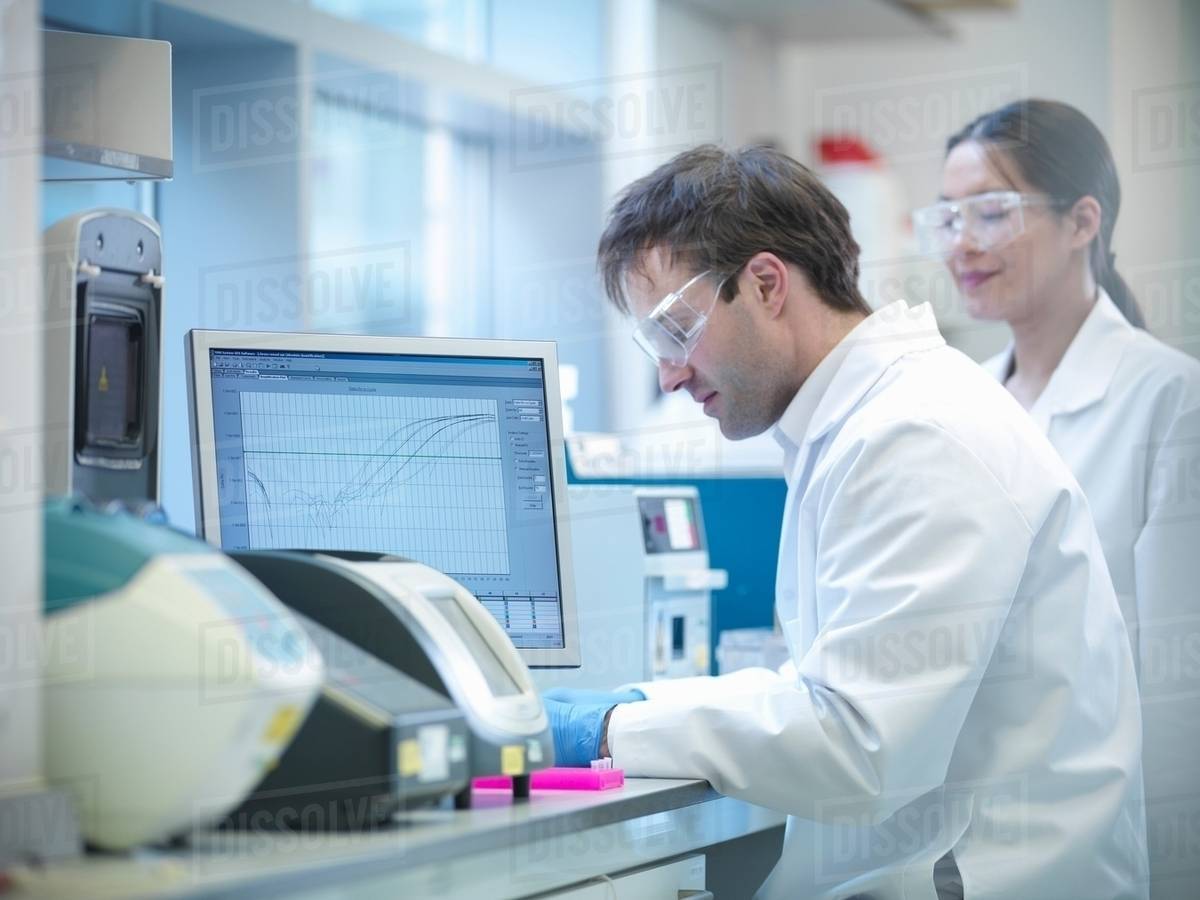 Scientists conducting the process of Polymerase chain reaction (PCR) to ...