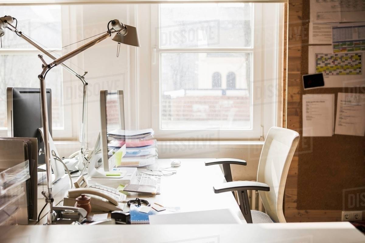 Empty desk in office - Stock Photo - Dissolve
