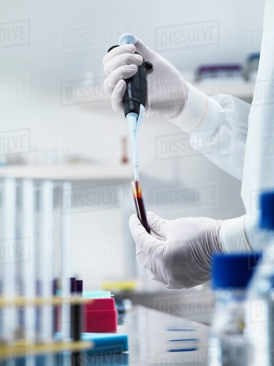 Scientist pipetting liquid in test tube - Royalty-free Stock Photo ...