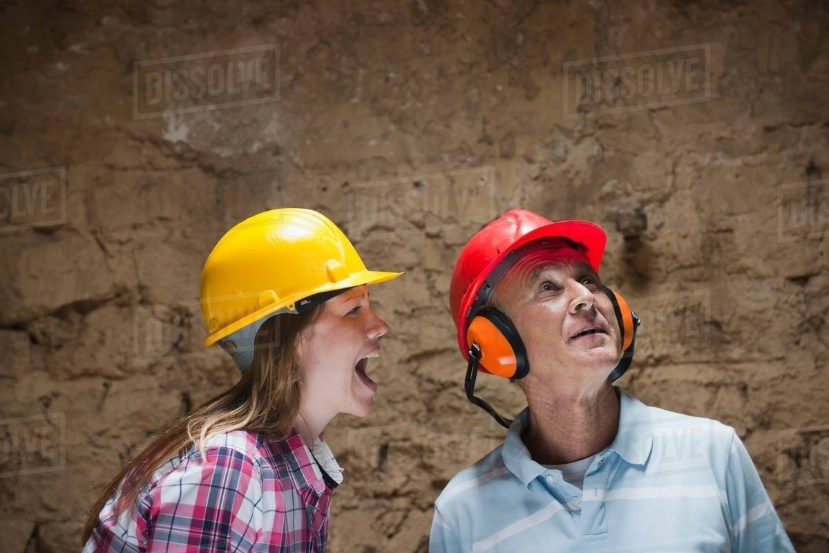 Construction worker yelling at colleague - Stock Photo - Dissolve
