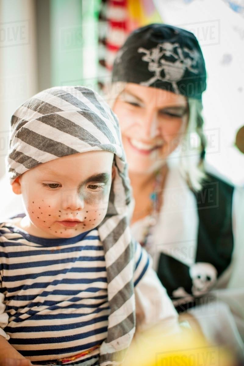 Mother and son wearing pirate costumes - Stock Photo - Dissolve