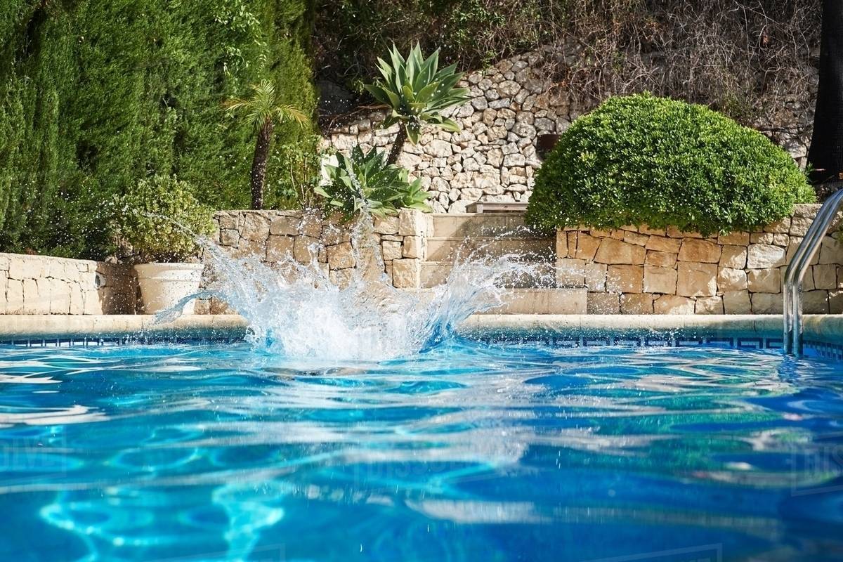 Splash in holiday apartment swimming pool - Royalty-free Stock Photo ...