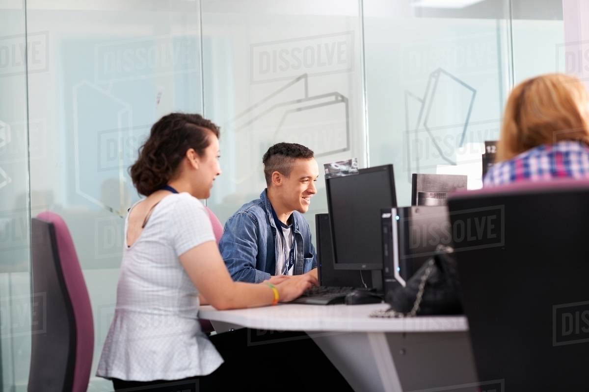 Group of students working together in computer class - Stock Photo ...
