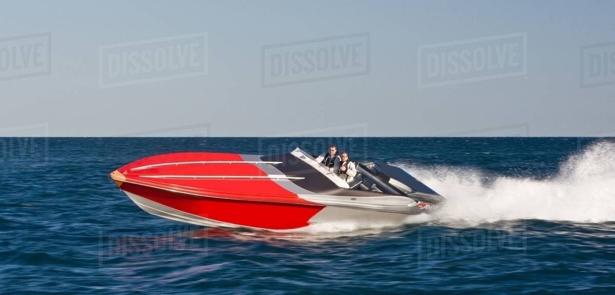 Powerboat racing at high speed - Stock Photo - Dissolve