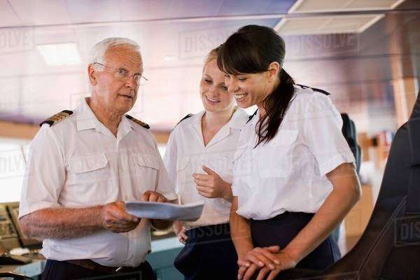 Captain giving advices to his assistants - Stock Photo - Dissolve