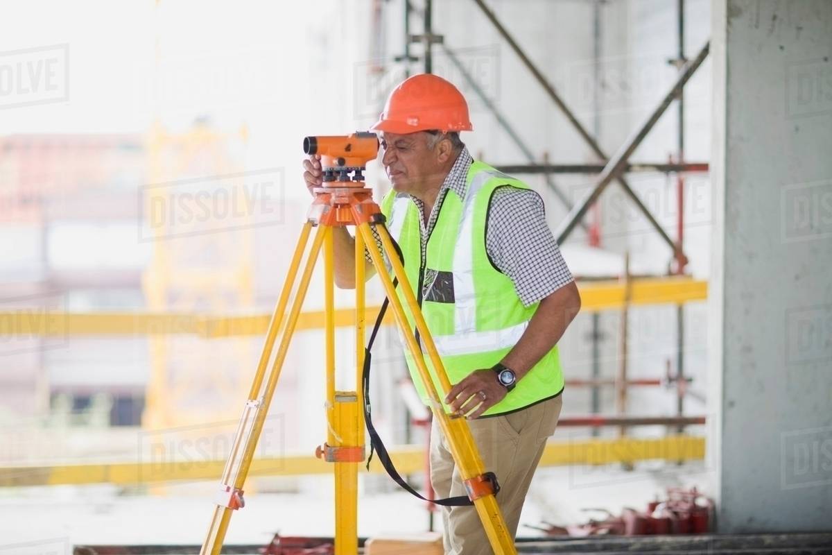 Worker with measuring equipment - Royalty-free Stock Photo | Dissolve