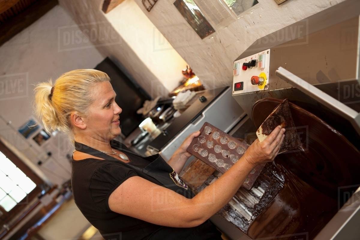 Woman making pralines - Royalty-free Stock Photo | Dissolve