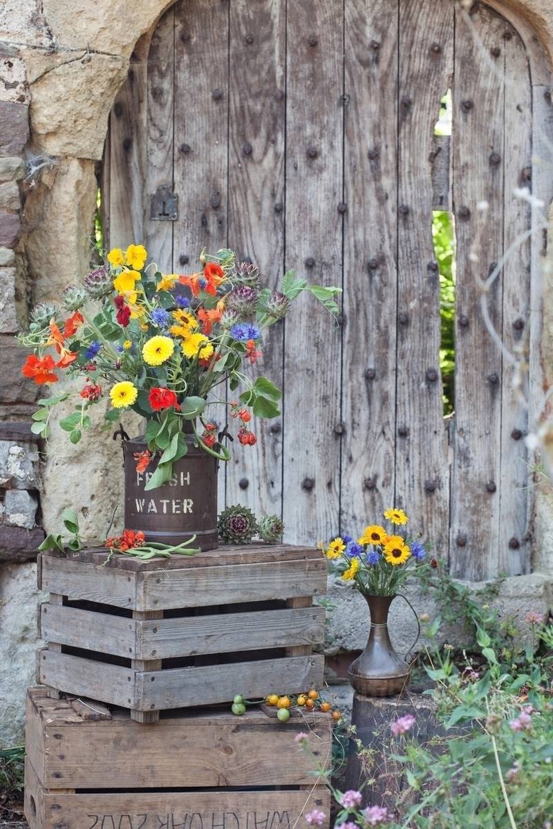 Fresh flowers in pot, on wooden crate - Royalty-free Stock Photo | Dissolve