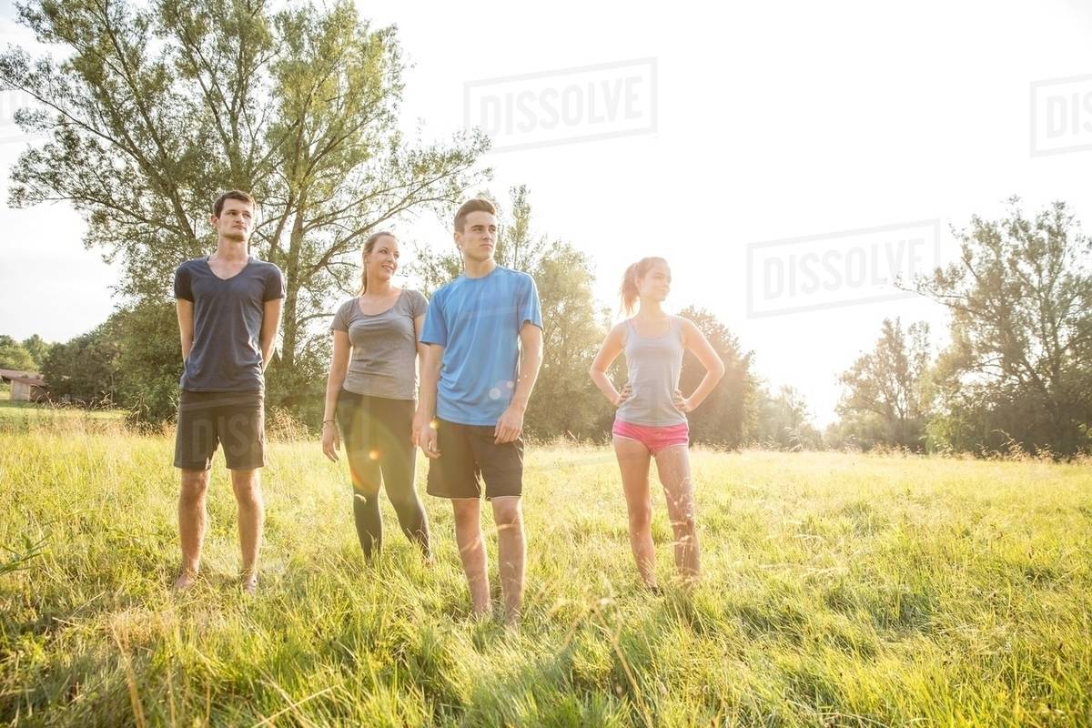 Portrait of group of friends, standing in field - Royalty-free Stock ...