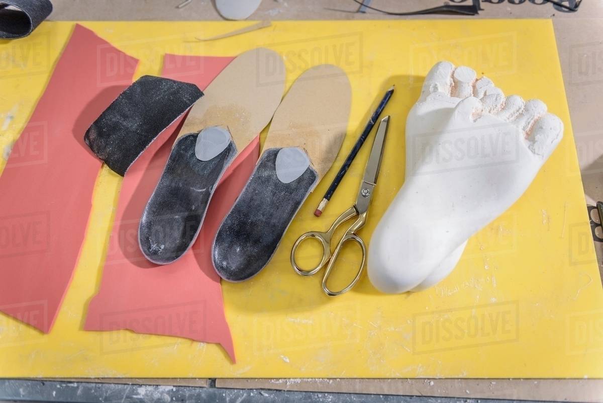 Shoe insoles made from plaster casts of feet in medical factory - Stock ...