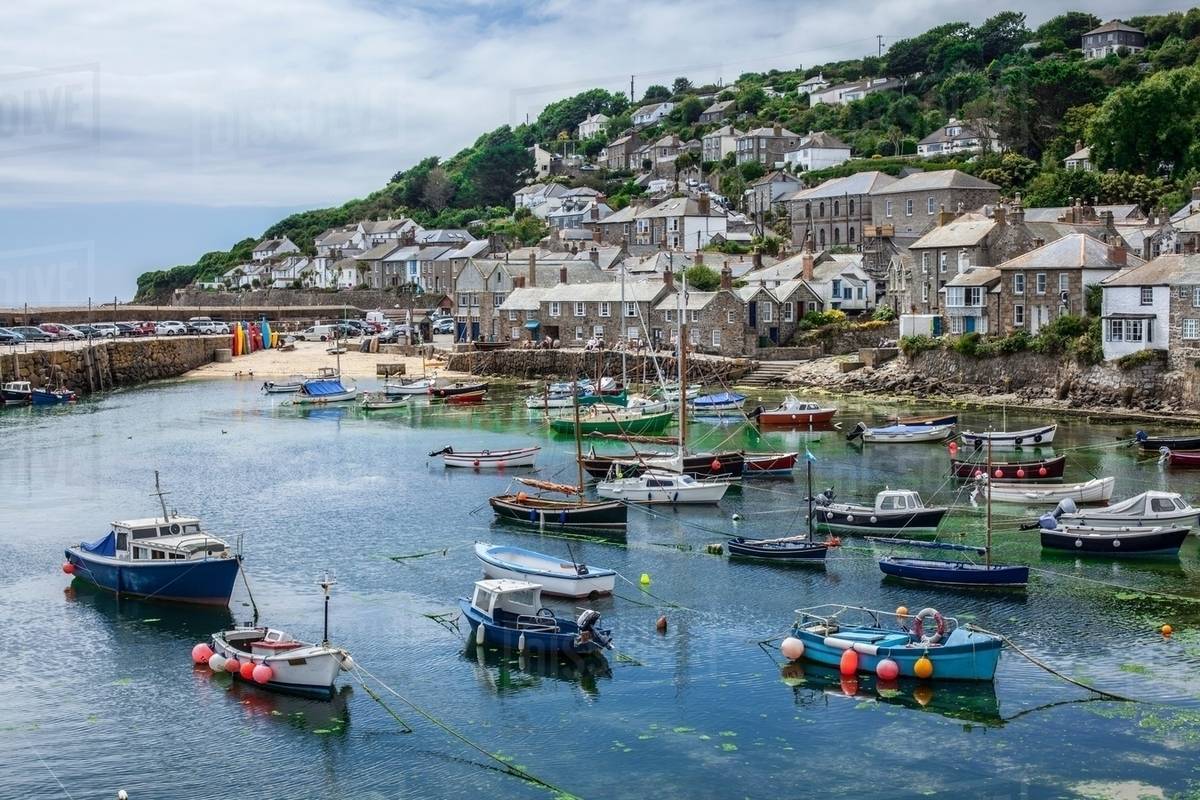 View of fishing boats and harbor, Mousehole, Cornwall, UK - Royalty ...
