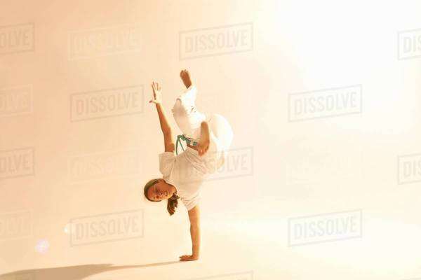 Woman practising capoeira - Royalty-free Stock Photo | Dissolve