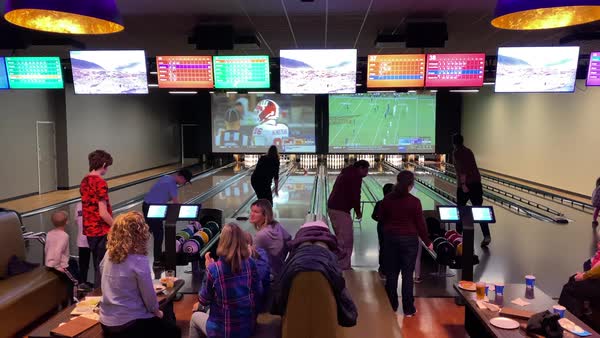 People having fun at the bowling alley together in private room - 4K ...