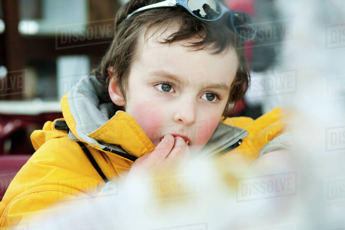 Little boy eating snack - Royalty-free Stock Photo | Dissolve