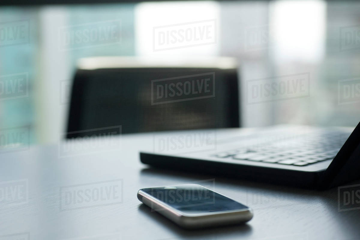 Cell phone and laptop computer - Royalty-free Stock Photo | Dissolve