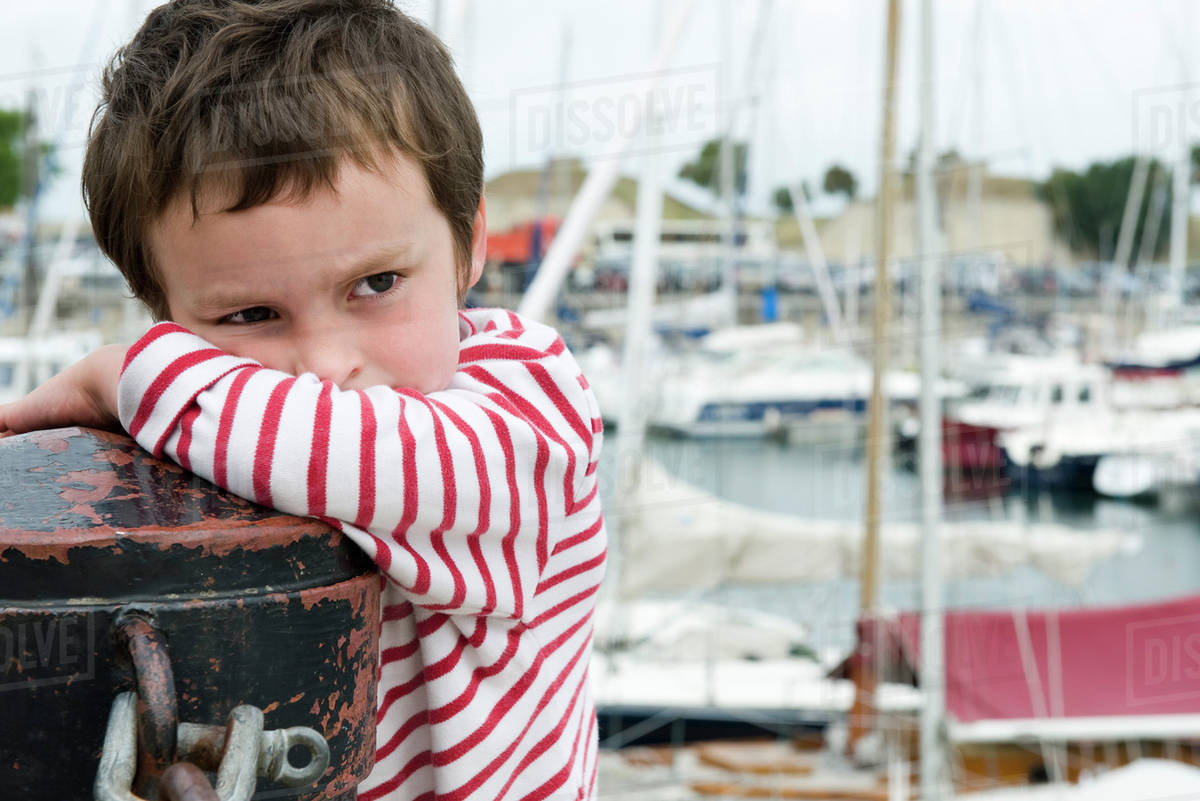Little boy sulking, portrait - Royalty-free Stock Photo | Dissolve