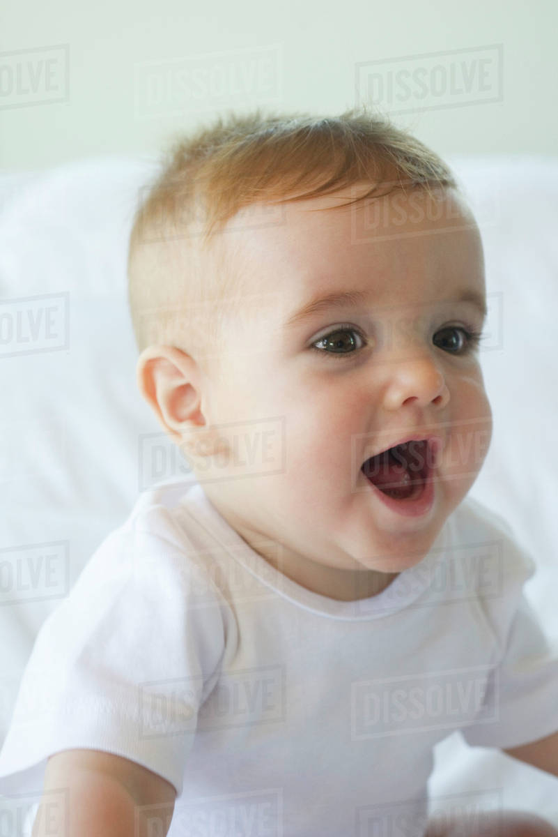 Infant looking away, portrait - Royalty-free Stock Photo | Dissolve