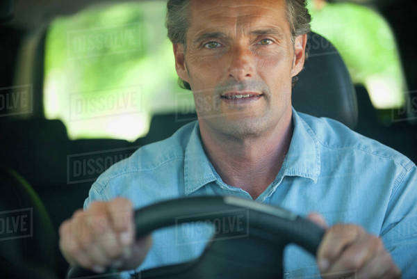 Man driving car, portrait - Royalty-free Stock Photo | Dissolve