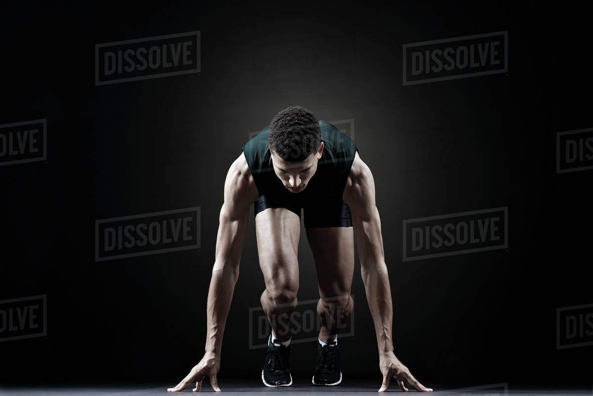 Runner at starting line - Stock Photo - Dissolve
