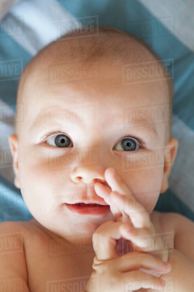 Baby looking up, portrait - Royalty-free Stock Photo | Dissolve