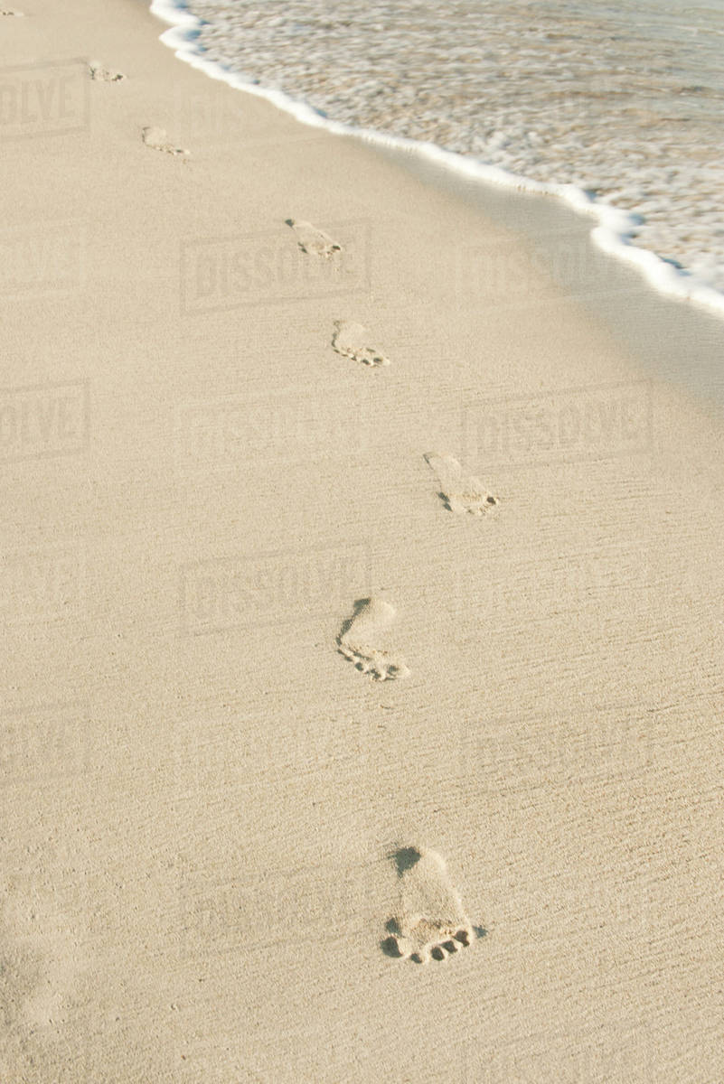 Footprints in sand - Royalty-free Stock Photo | Dissolve