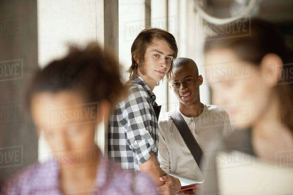 Young man with friend, focus on one person - Royalty-free Stock Photo ...