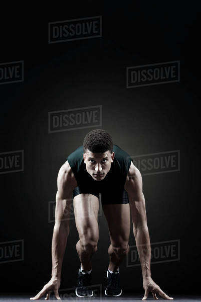 Runner at starting line - Stock Photo - Dissolve