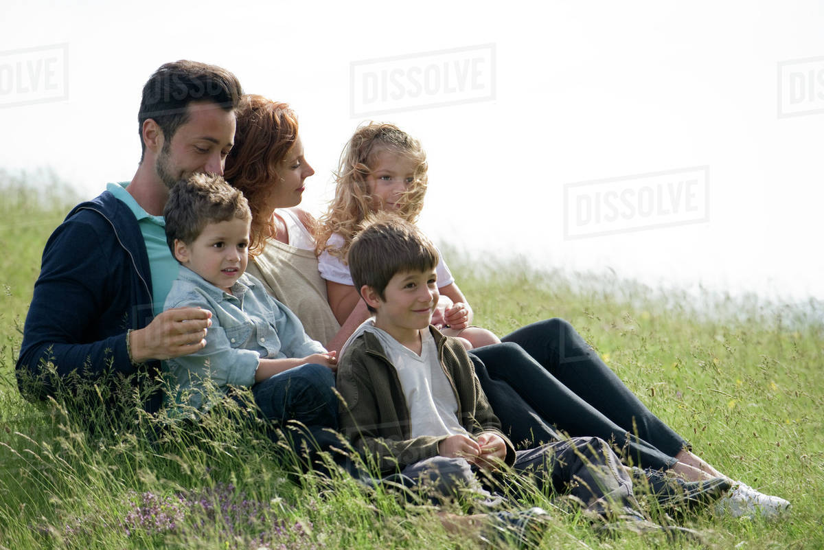 Family relaxing together outdoors - Royalty-free Stock Photo | Dissolve