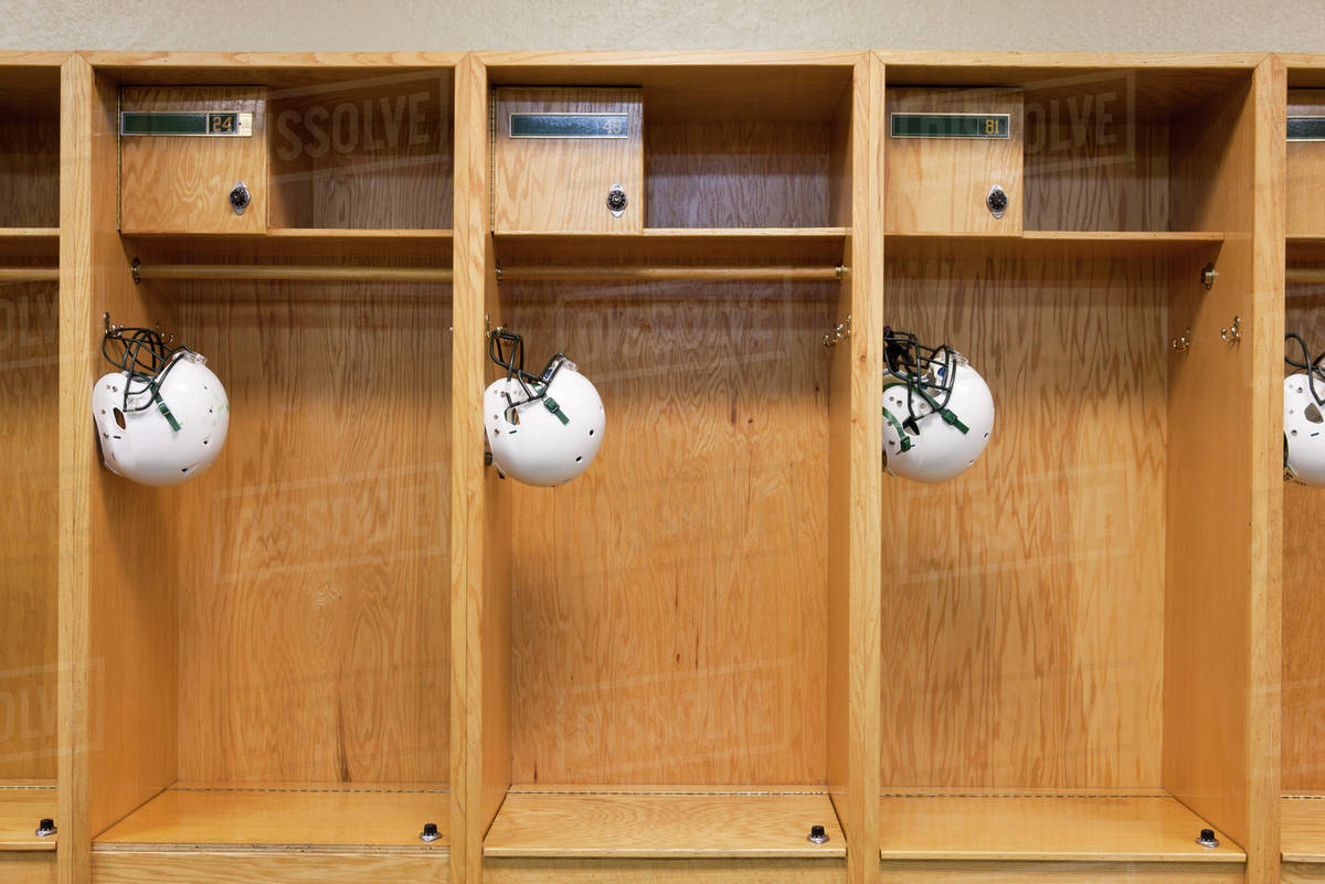 Football helmets hanging in locker room - Royalty-free Stock Photo ...