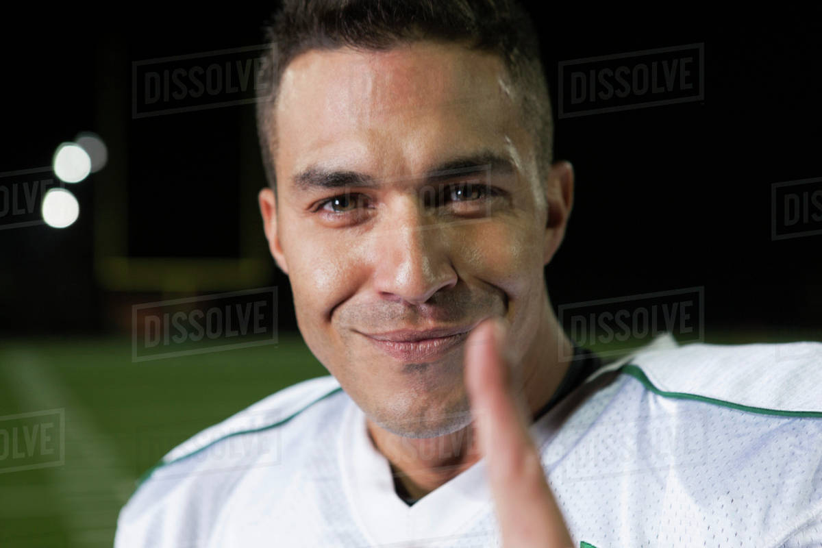 Football smiling confidently at camera, portrait - Royalty-free Stock ...