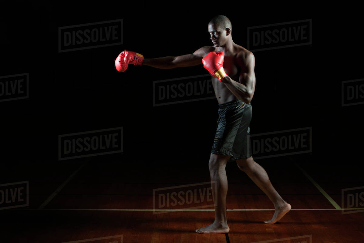 Boxer practicing in stadium - Royalty-free Stock Photo | Dissolve