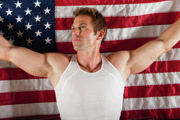 Male athlete in front of American flag - Royalty-free Stock Photo ...