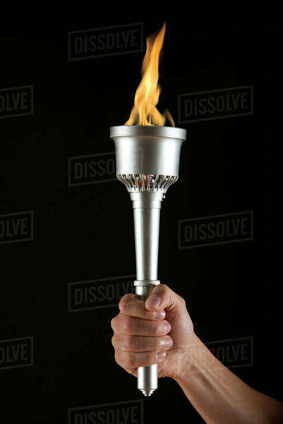 Man's hand holding torch with no flame, cropped - Royalty-free Stock ...